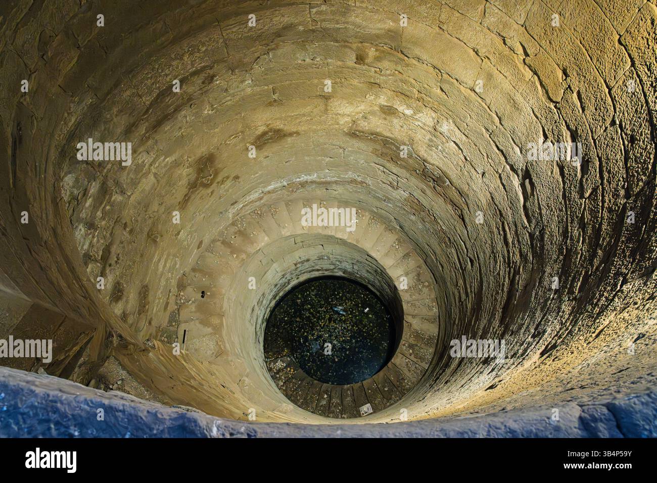 Looking down inside the well at the construction and steps leading to ...