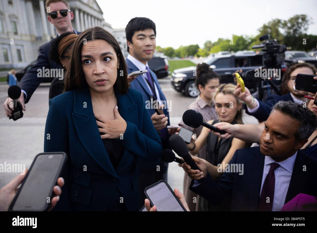 Rep. Alexandria Ocasio-Cortez (D-N.Y.) speaks with reporters as she ...