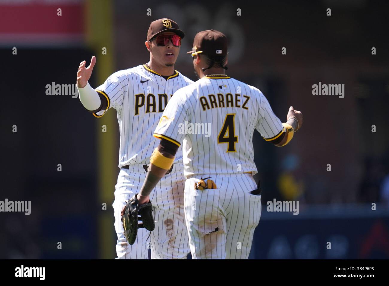San Diego Padres third baseman Manny Machado, left, celebrates with ...