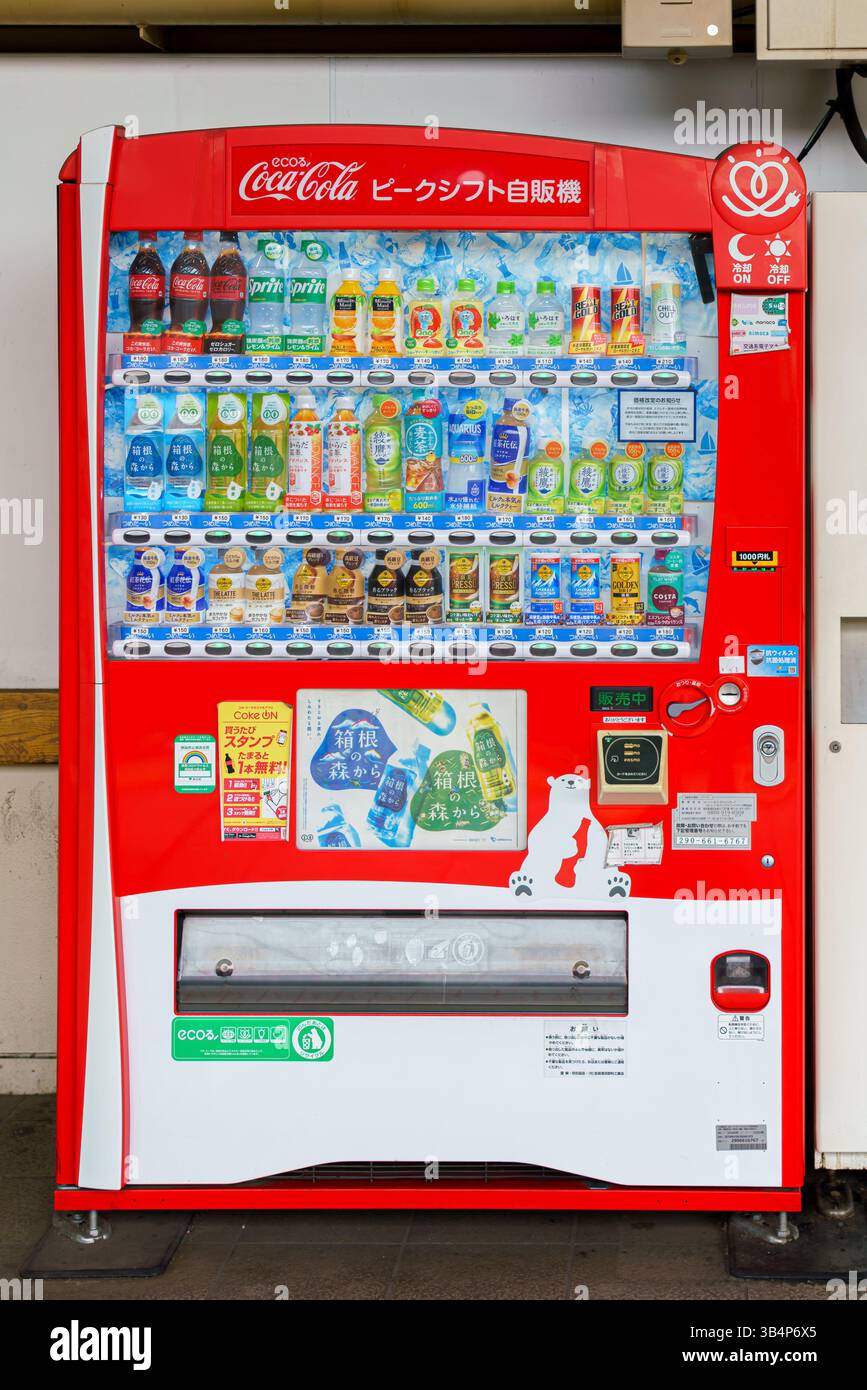 Tokyo, Japan - Sep 30 2024, Vertical close-up view of red vending ...