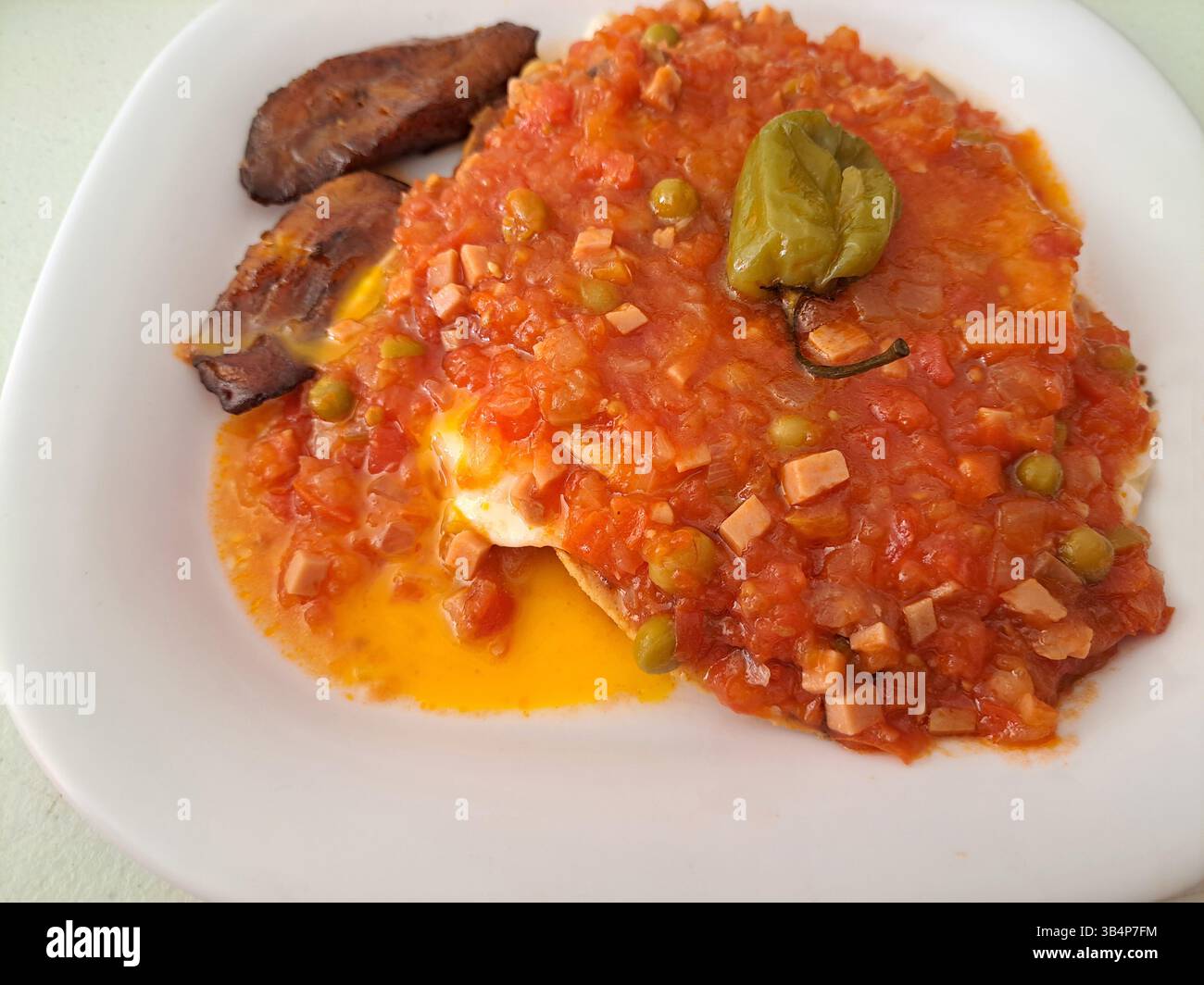 Huevos motulenos are a typical breakfast dish from the town of Motul in ...