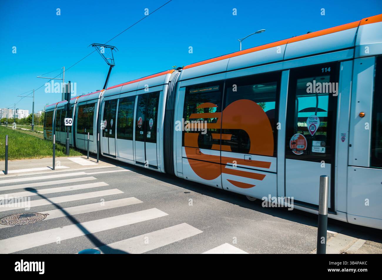 Reims, France - April 30, 2025. A modern electric tram runs through the ...