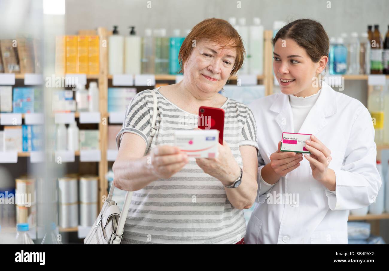 Woman buyer scans paracetamol qr code with woman pharmacist Stock Photo ...