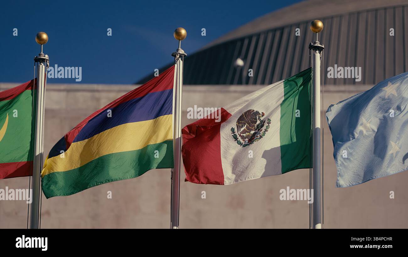 Flags of the world waving at the United Nations headquarters in New ...