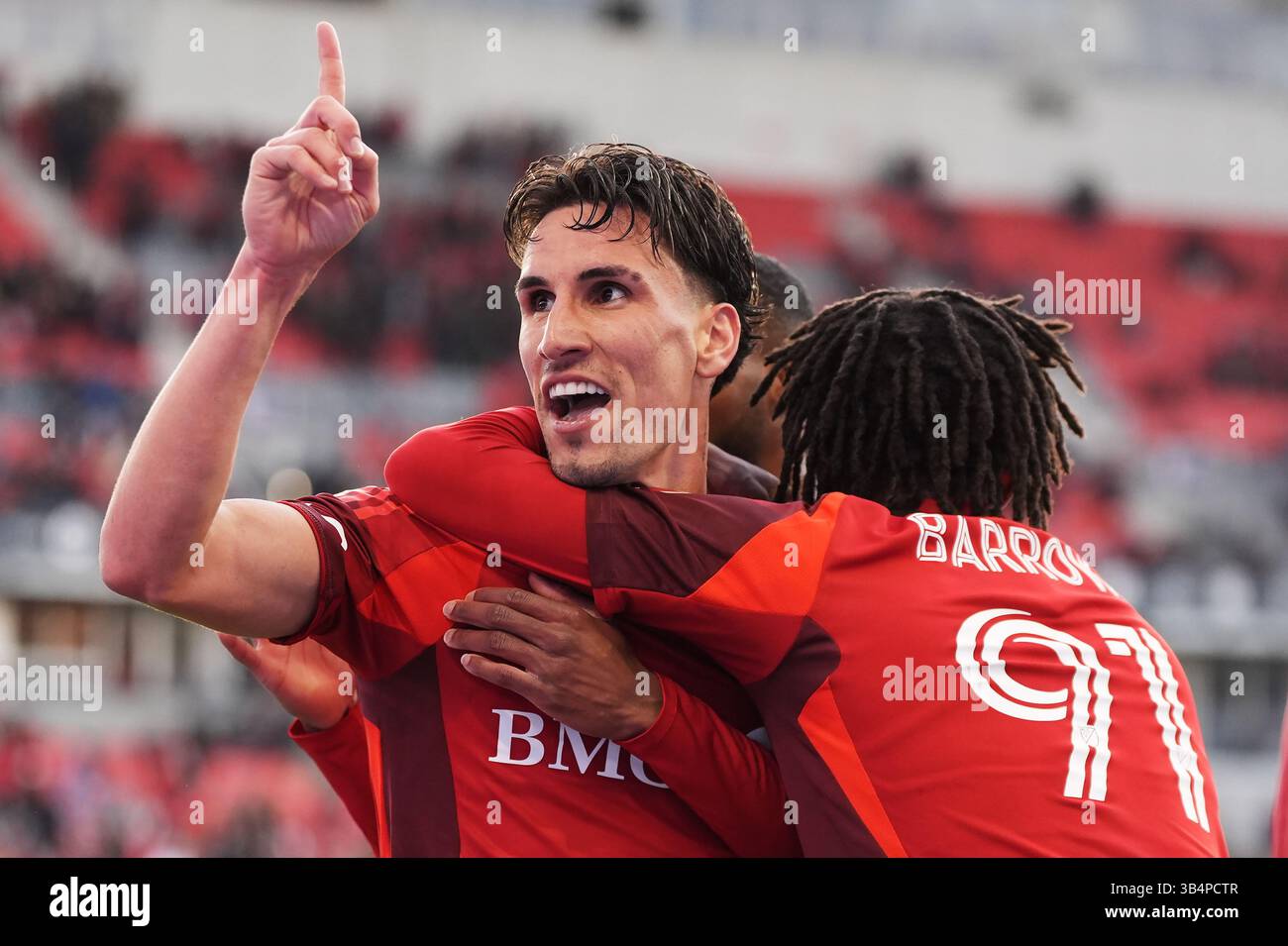 Toronto, Canada. 30th Apr, 2025. Toronto FC's Theo Corbeanu (left ...