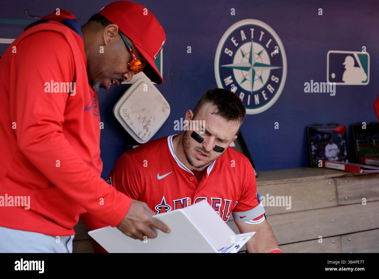 Los Angeles Angels' Mike Trout talks with batting coach Johnny ...