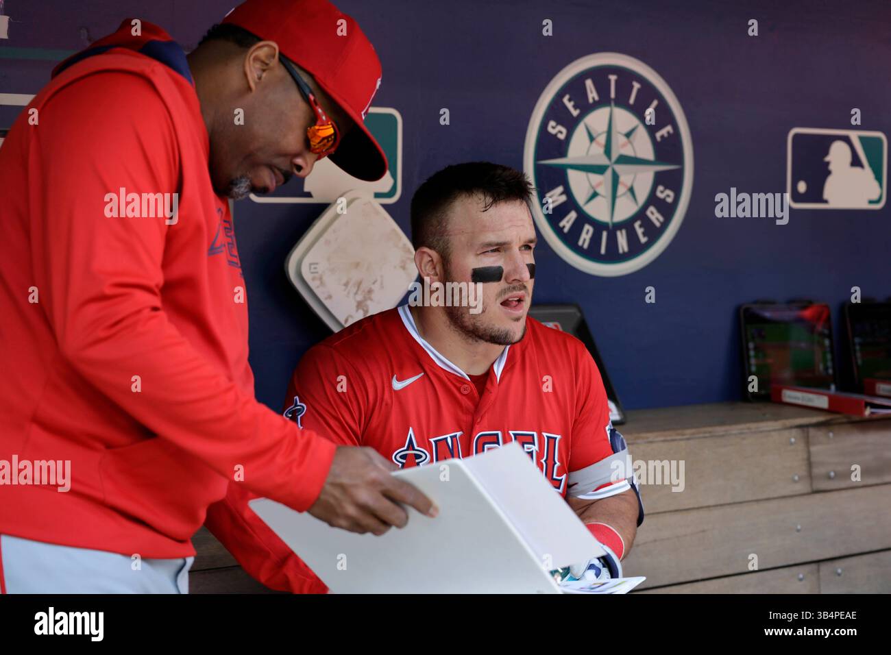 Los Angeles Angels' Mike Trout talks with batting coach Johnny ...