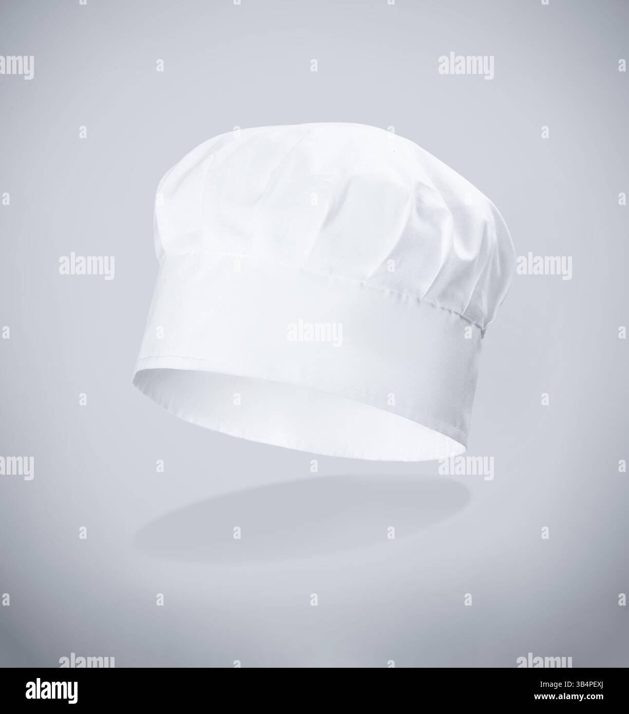 White chef's hat in air on grey background. Part of traditional uniform ...