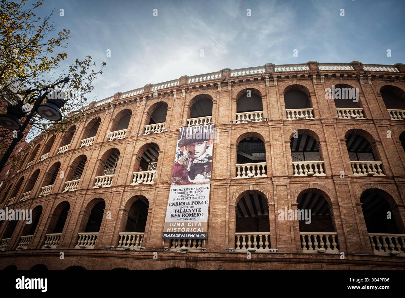 VALENCIA, SPAIN - OCTOBER 13, 2024: Low‑angle view of Valencia’s brick ...