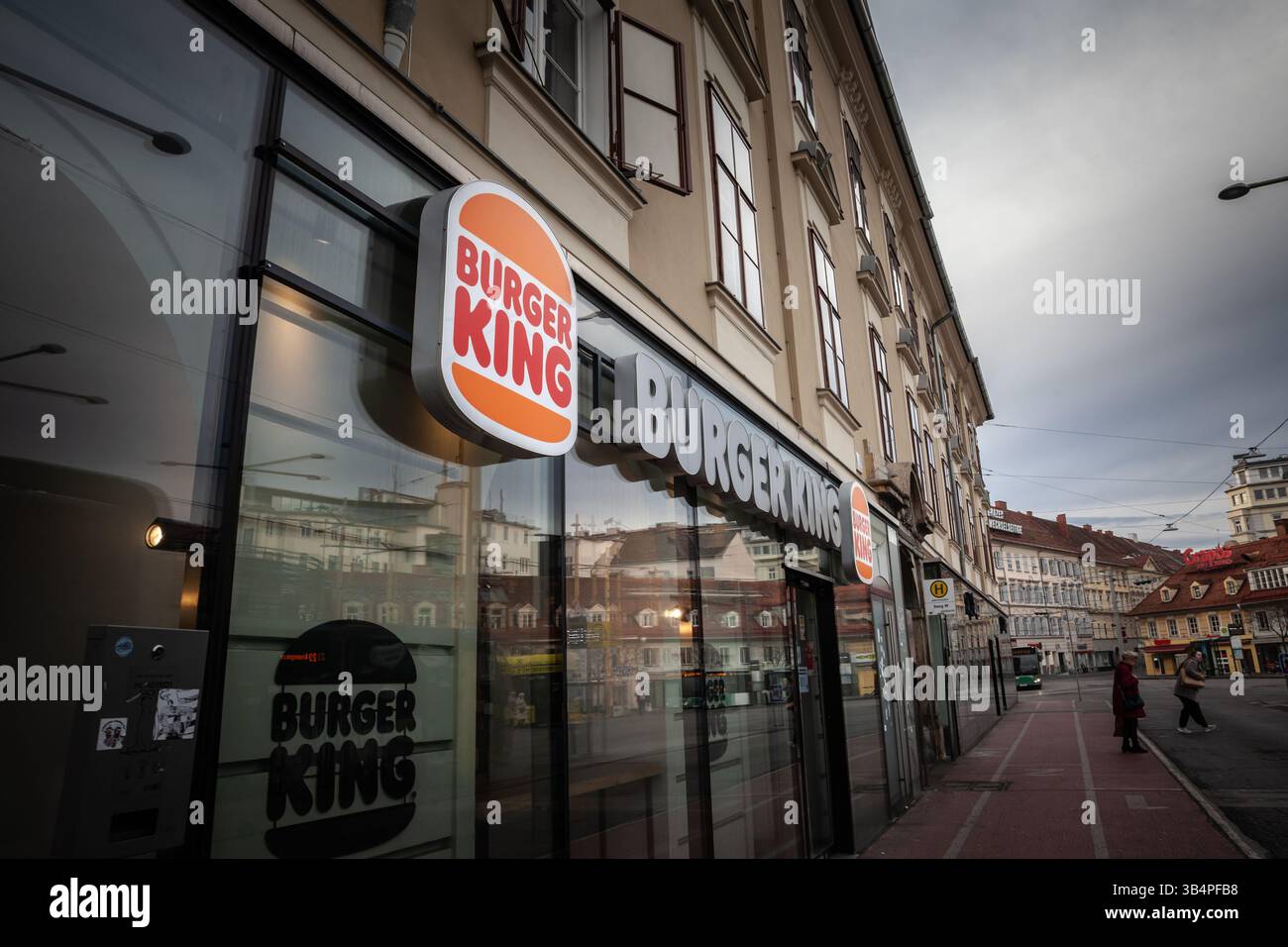 GRAZ, AUSTRIA - DECEMBER 17, 2024: New-design Burger King logo glows on ...