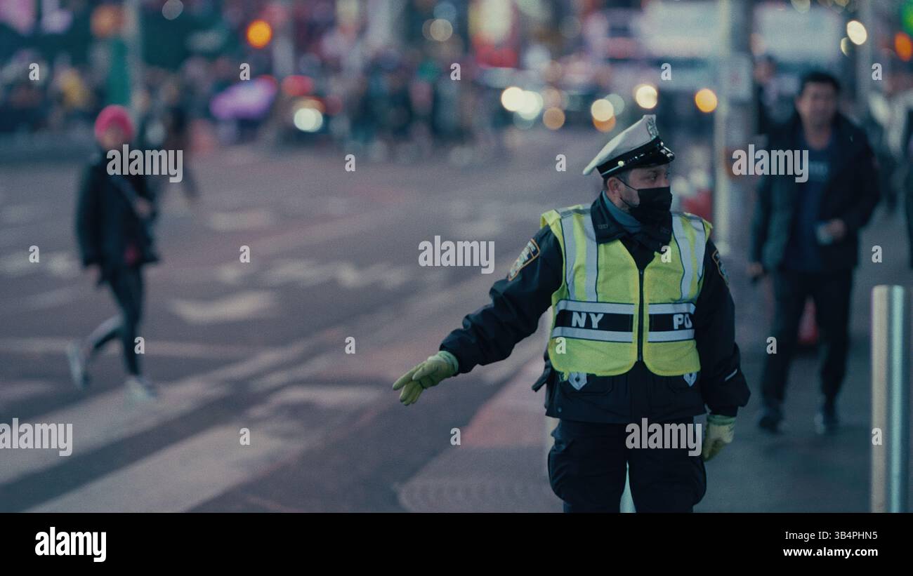 NEW YORK, USA - FEBRUARY 14, 2025 - Policeman wearing face mask ...