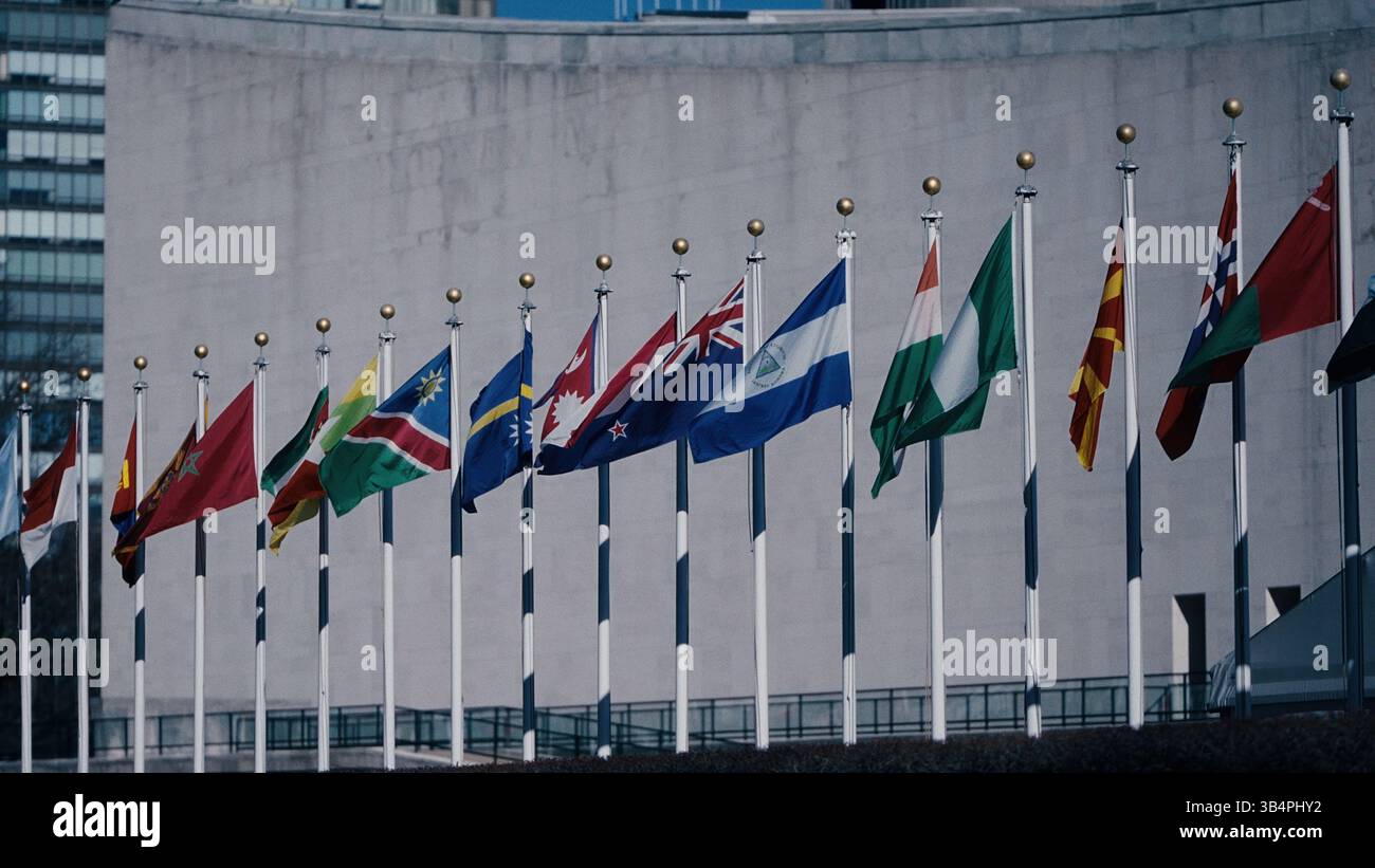 Flags of the world waving at the United Nations headquarters in New ...