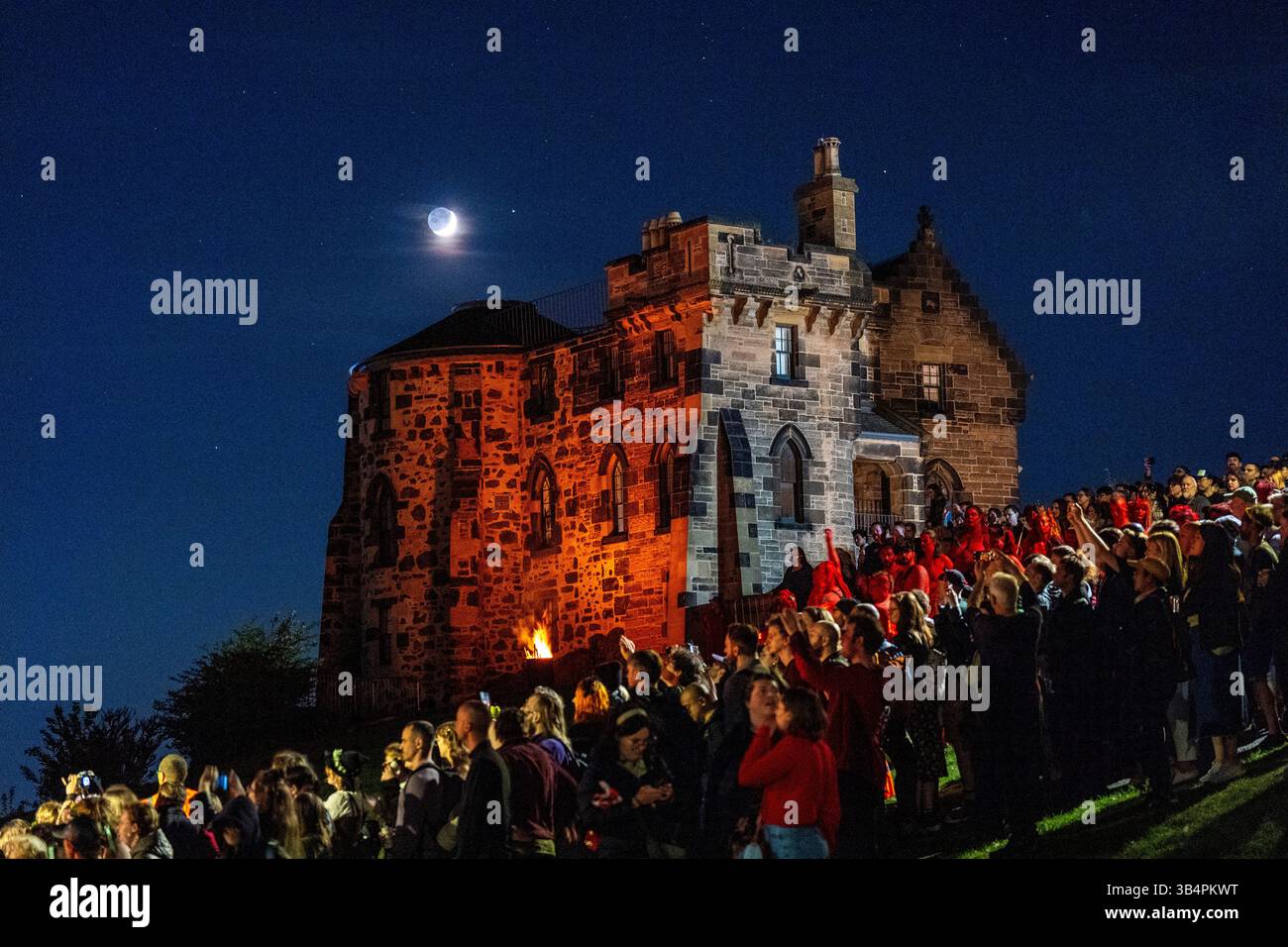 Members of the public during the Beltane Fire Festival in Edinburgh. A ...