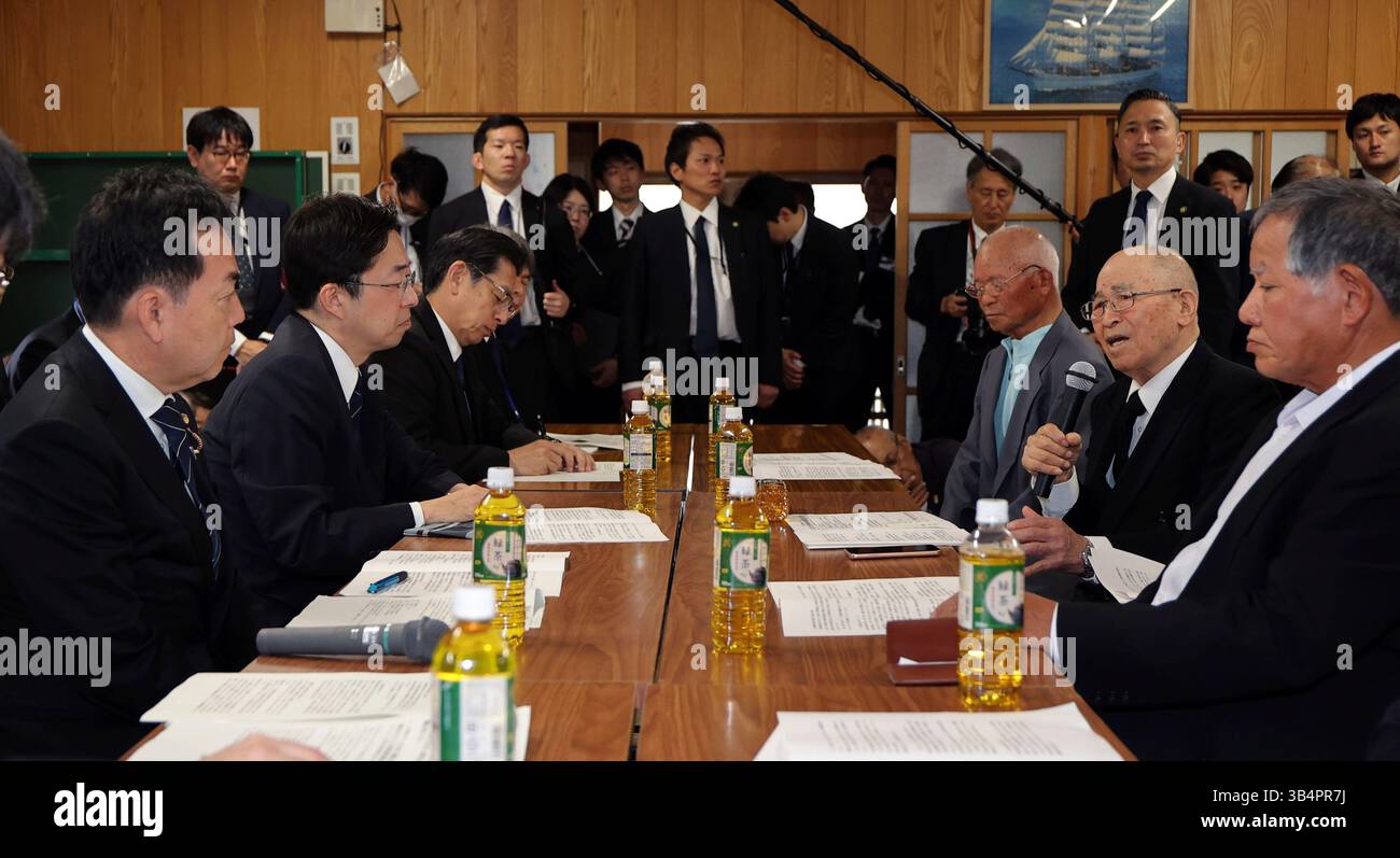 Japanese Minister of the Environment Keiichiro Asao (left) and members ...
