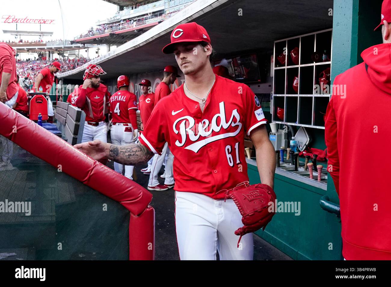 Cincinnati Reds pitcher Chase Petty (61) leaves the dugout during the ...