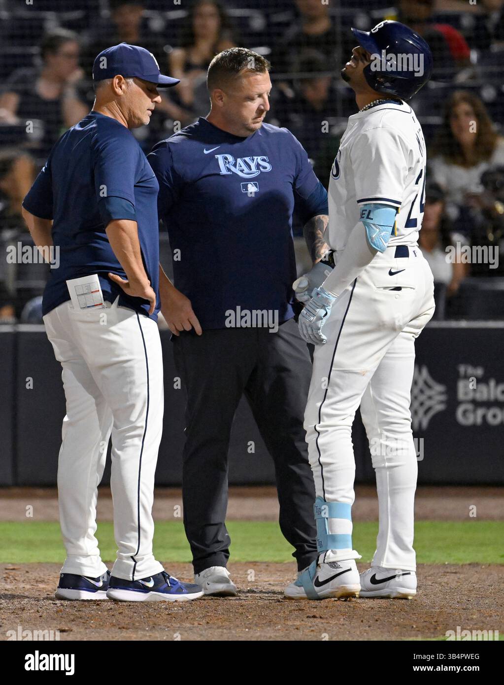 Tampa Bay Rays manager Kevin Cash (left) checks on Christopher Morel ...