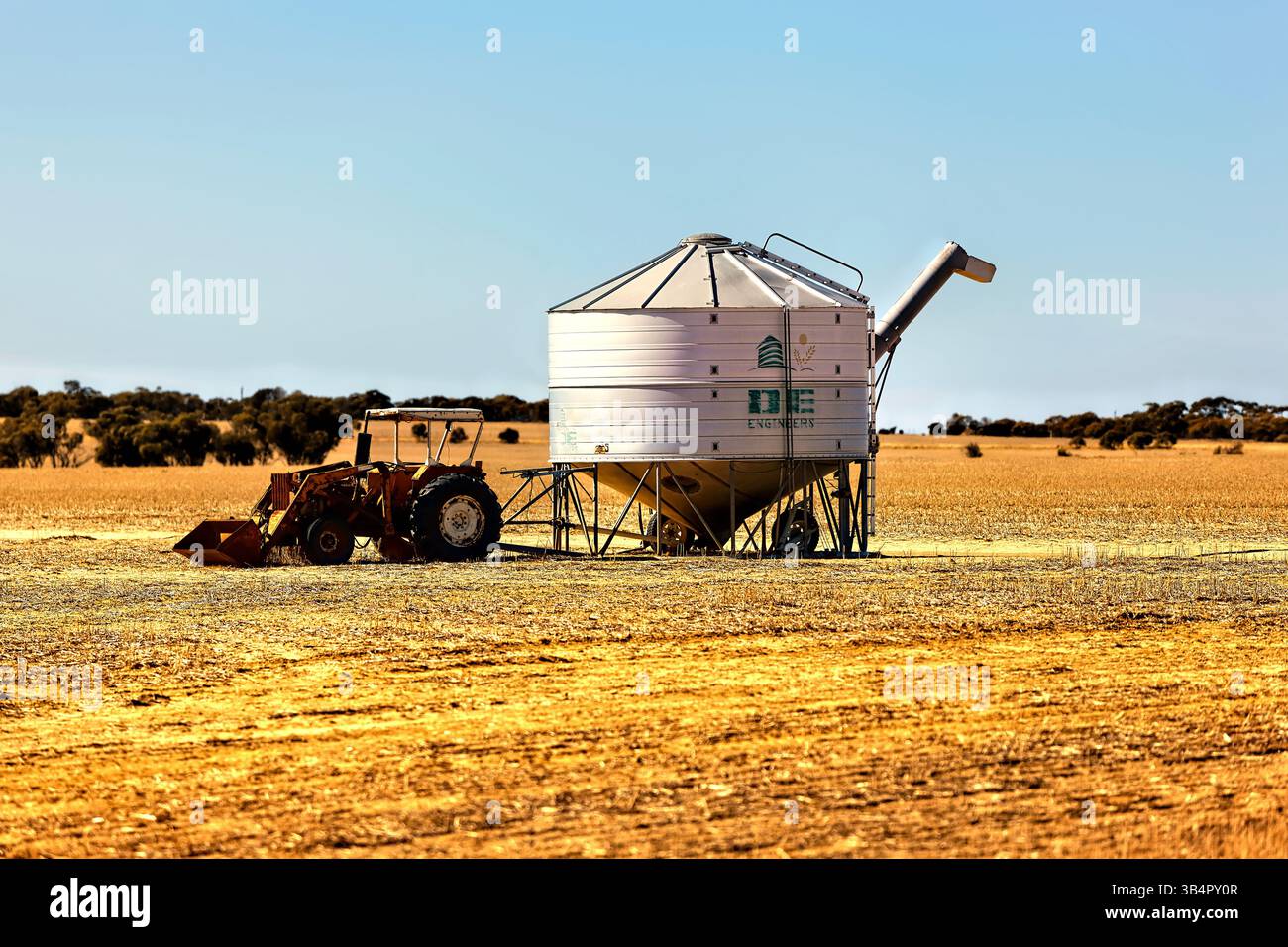 Tractor and grain auger hopper, Western Australia Stock Photo - Alamy
