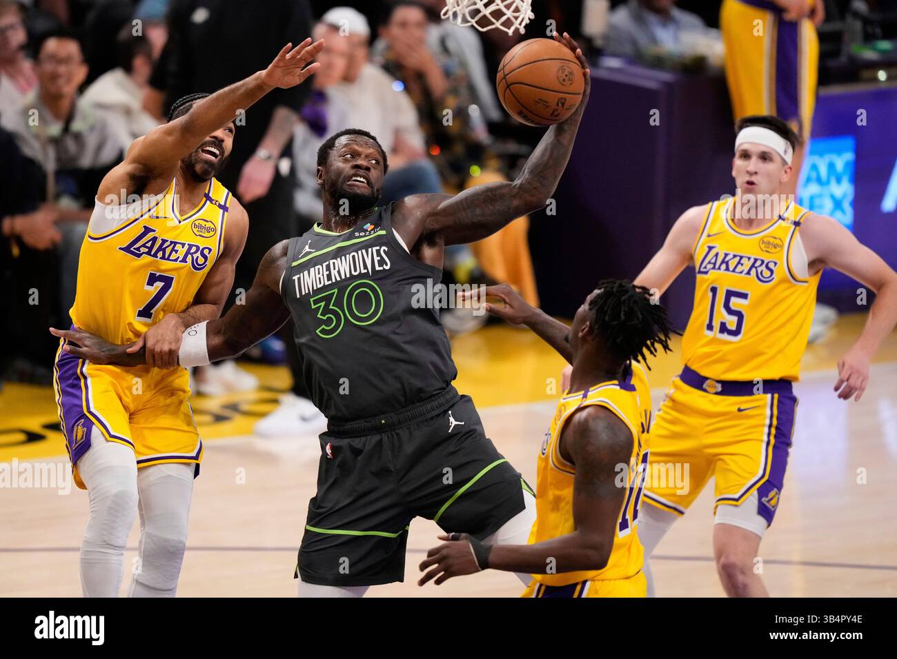 Minnesota Timberwolves forward Julius Randle (30) grabs a rebound next ...
