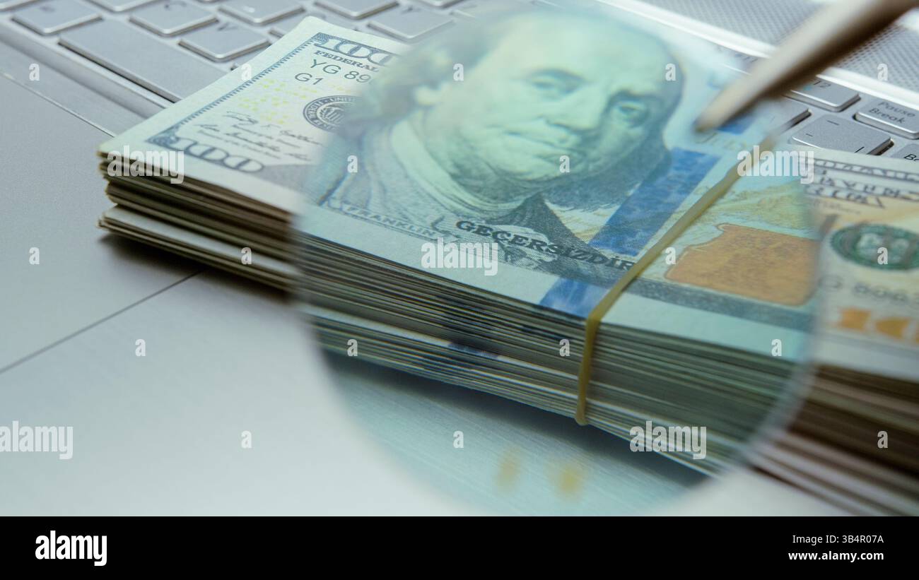 Close-Up of Counterfeit Money Inspection with Ultraviolet Light on ...