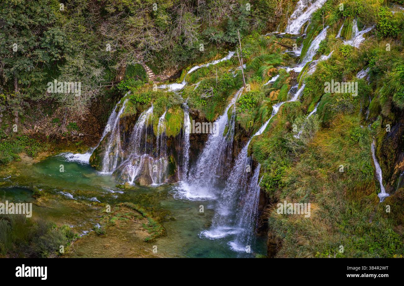 Waterfalls in the forest flowing into lakes. Tourists visit famous ...