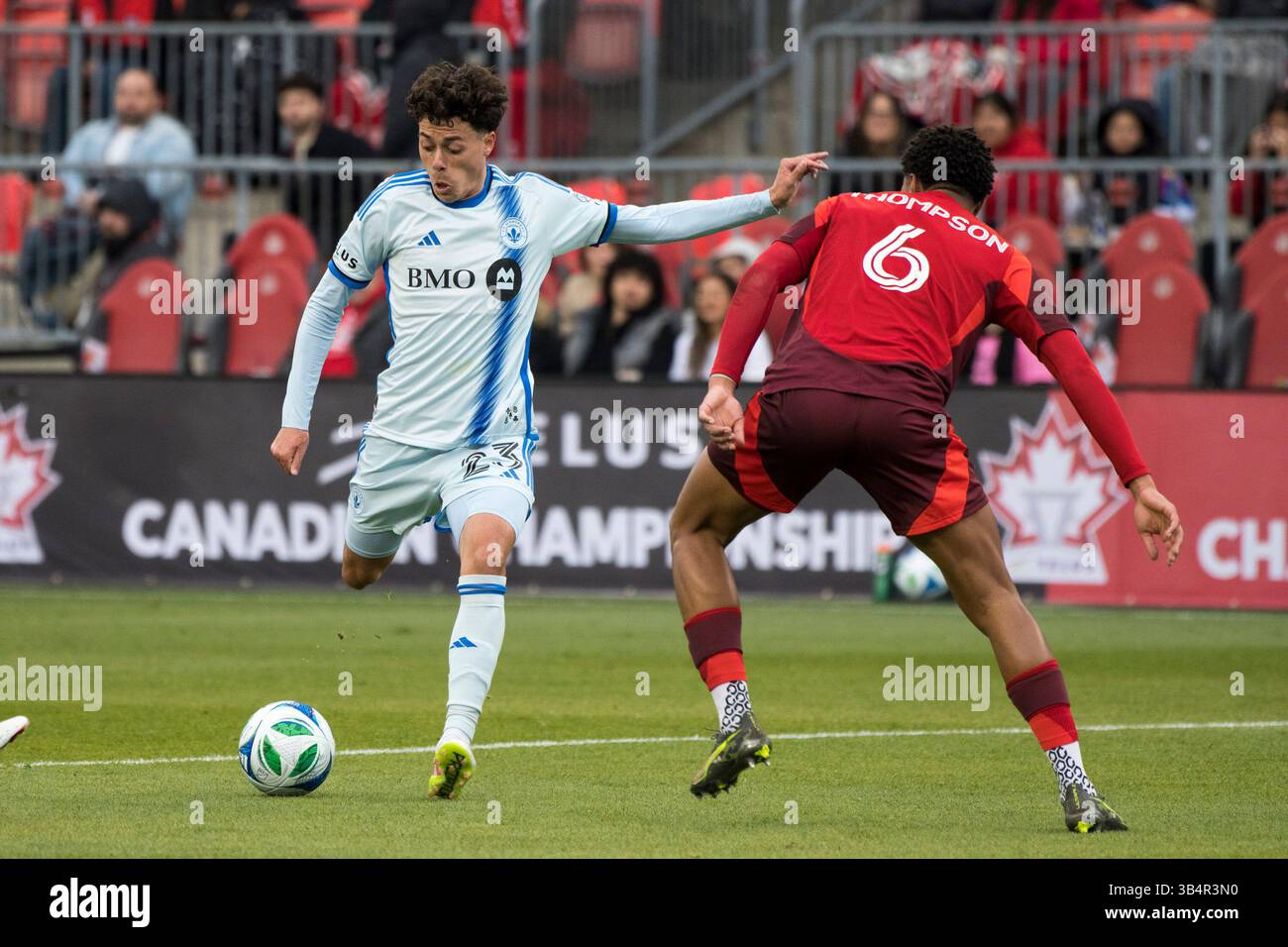 Caden Clark #23 (L) and Kosi Thompson #6 (R) seen in action during the ...