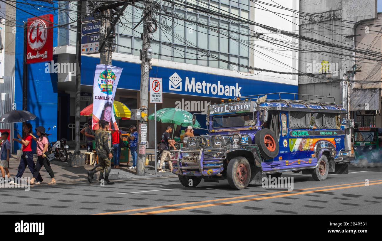Traditional public transport Jeepneys on the streets of Tagbilaran City ...