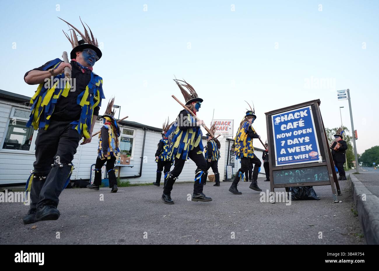 Members of the Hook Eagle Morris perform outside the Shack Cafe near to ...
