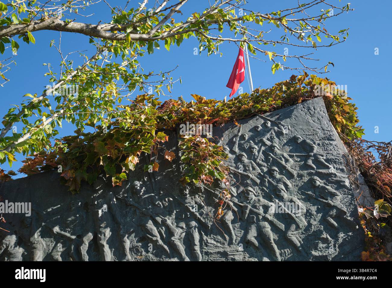 An exterior bronze frieze of battle, with Turkish flag flying. At Epic ...