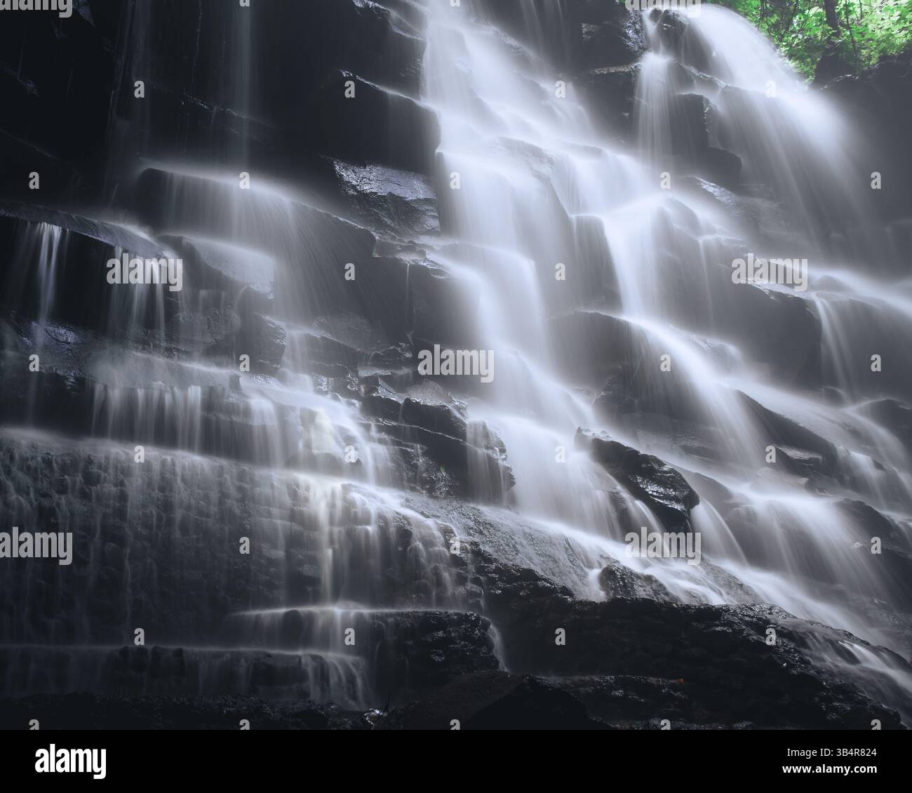 Powerful waterfall cascades over rocks hi-res stock photography and ...