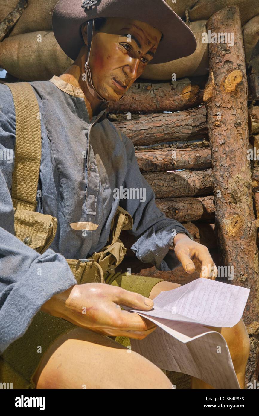 A diorama, recreation of a typical ANZAC soldier reading a letter in a ...