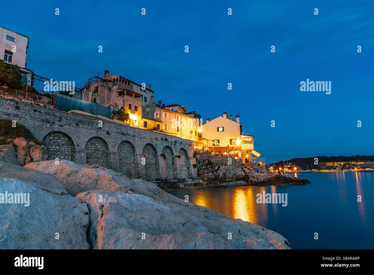 Panorama of the city of Rovinj during a night walk, the city walls at ...