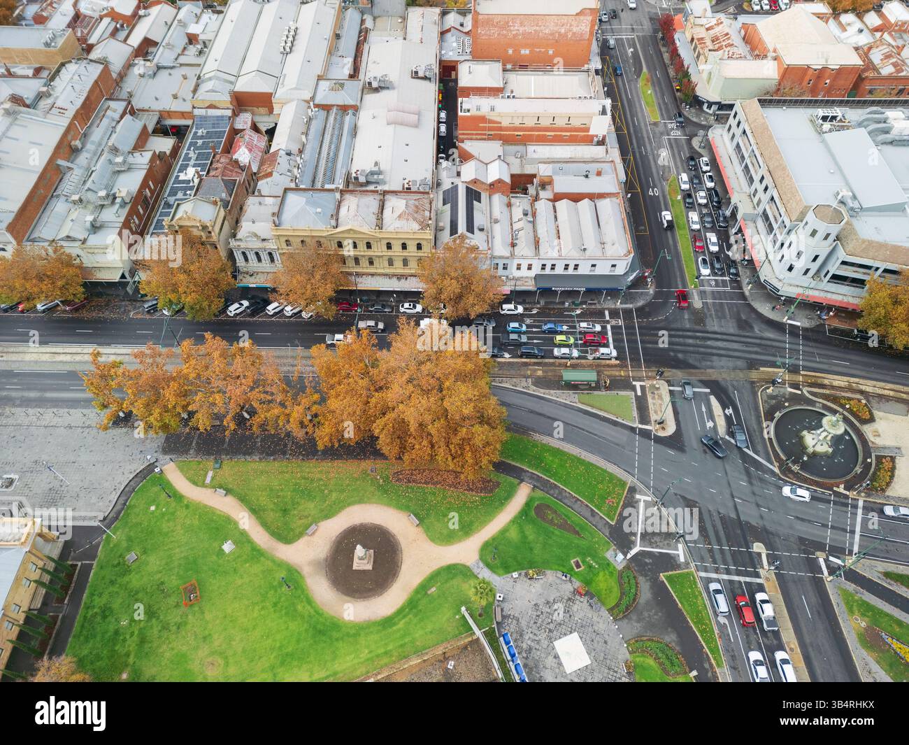 Aerial view of walking tracks through parkland surrounded by Autumn ...