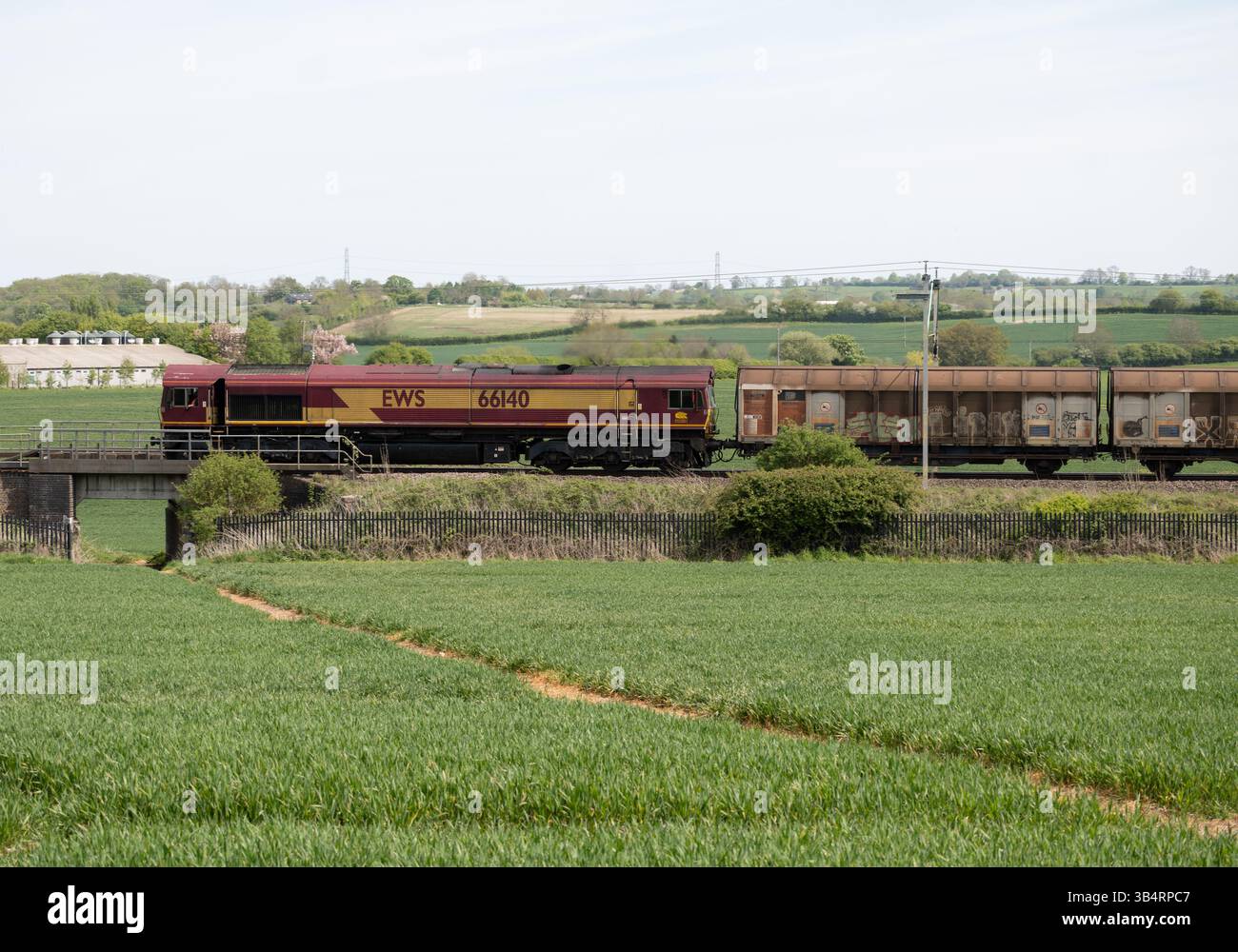 EWS class 66 diesel locomotive No. 66140 pulling a freight train near ...