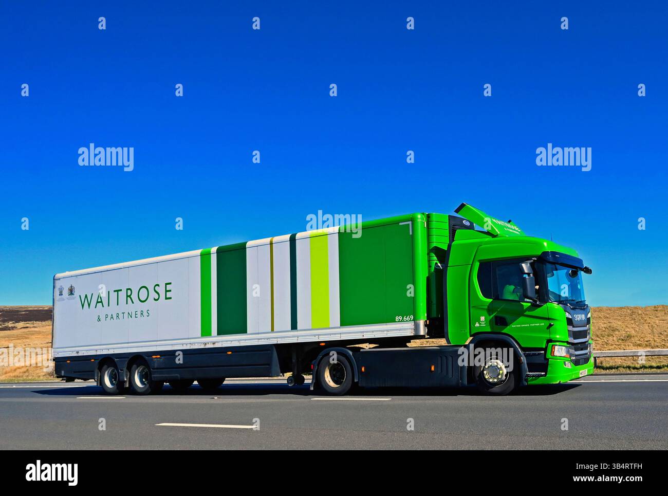 Waitrose & Partners HGV travelling at speed on the M6 Motorway ...