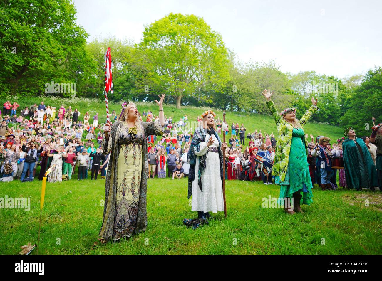 People during the Beltane celebrations at Glastonbury Chalice Well ...