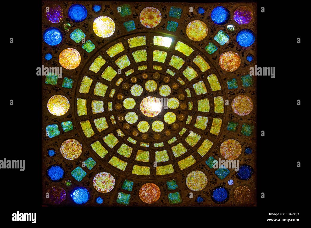 Vibrant stained glass artwork featuring concentric circles and ...
