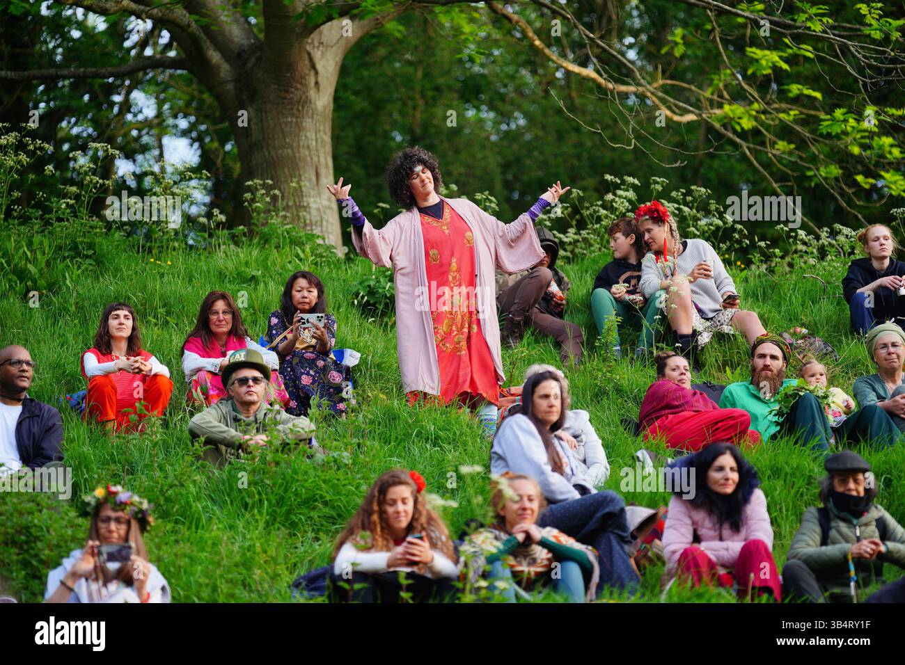 People during the Beltane celebrations at Glastonbury Chalice Well ...