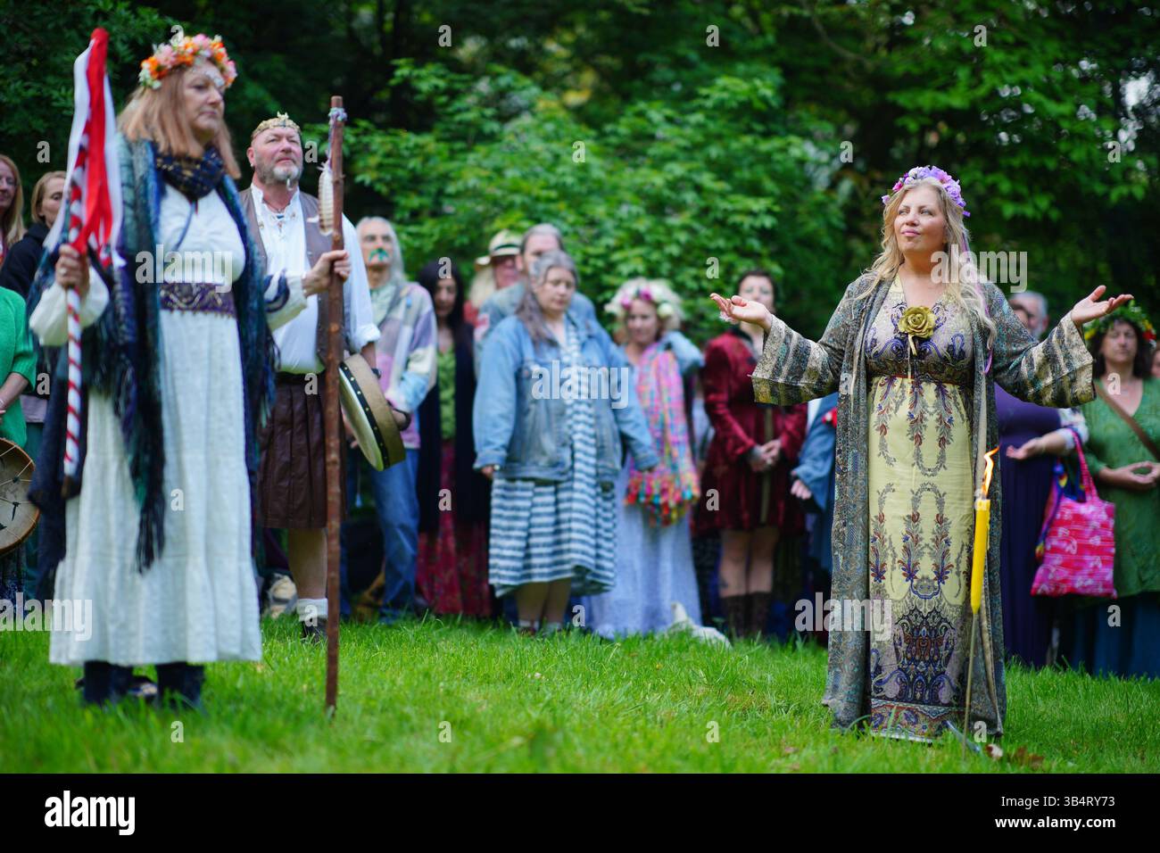 People during the Beltane celebrations at Glastonbury Chalice Well ...