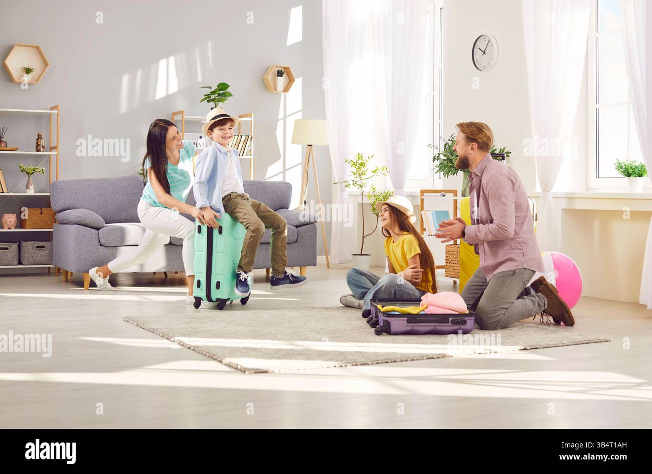 Positive Family Getting Ready For Summer Vacation Stock Photo - Alamy