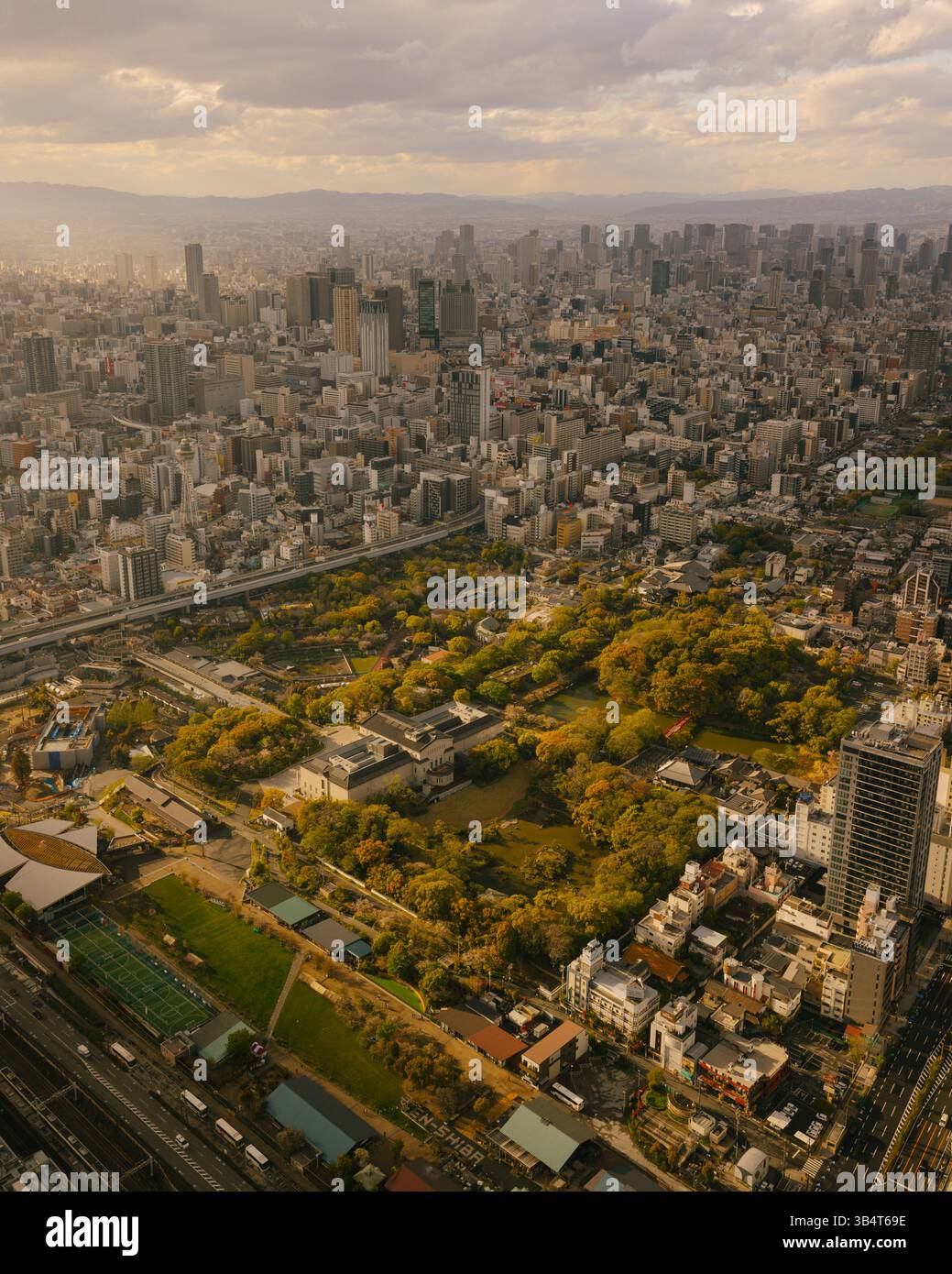 Aerial view of Osaka cityscape during a stormy dramatic sunset showing ...