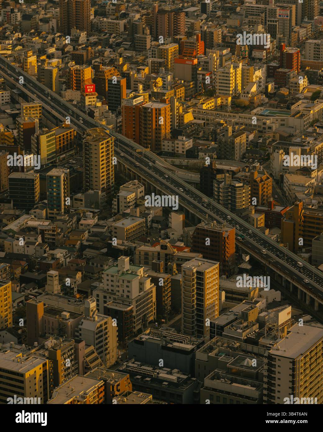 Aerial view of Osaka cityscape during a stormy dramatic sunset showing ...