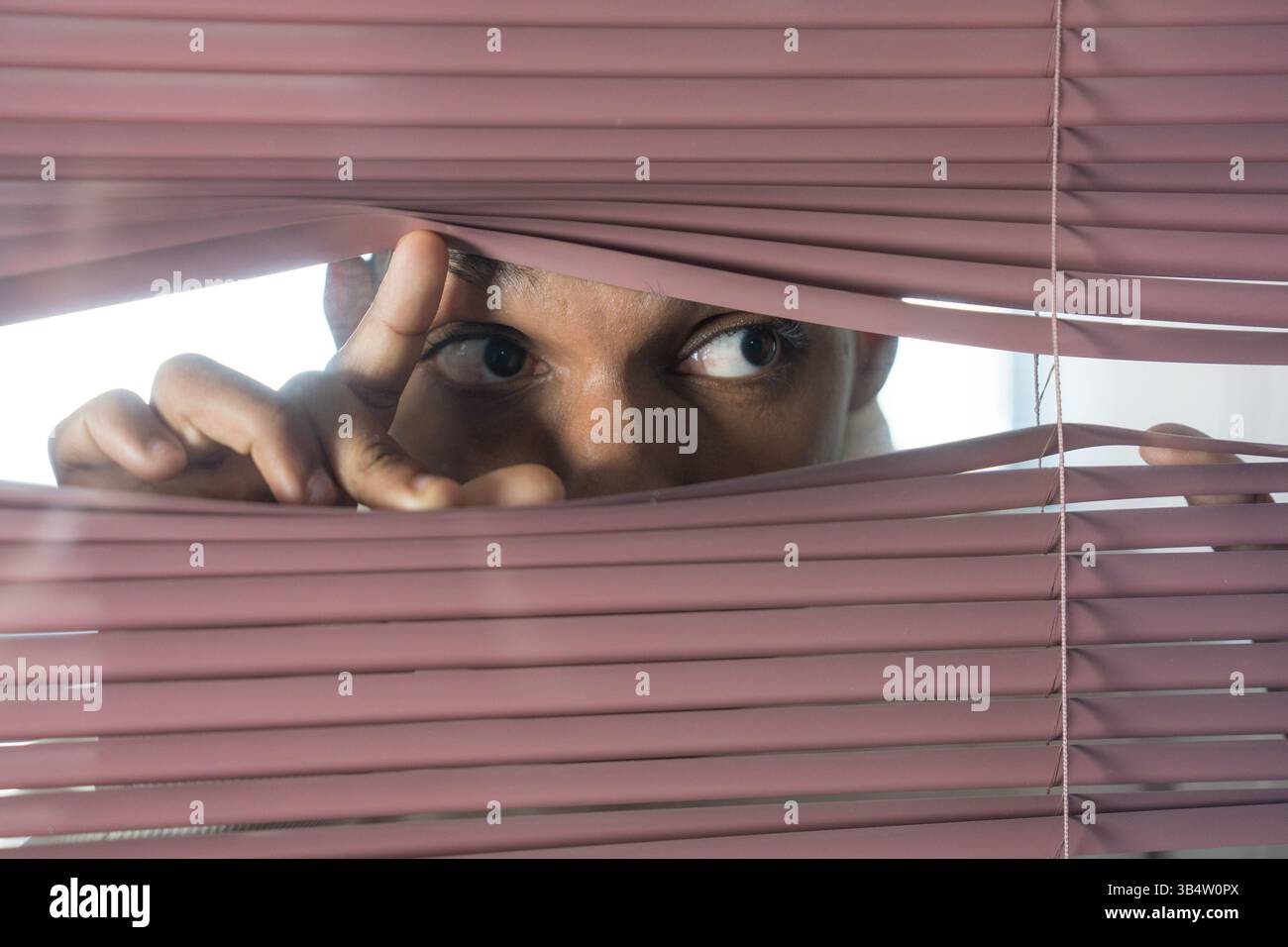 Curious man peeking something hi-res stock photography and images - Alamy
