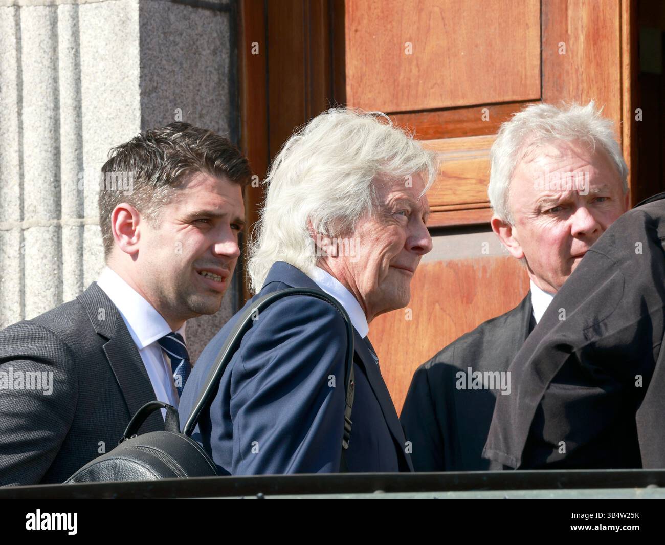 Solicitor Paul Tweed (centre) outside the High Court in Dublin, where ...