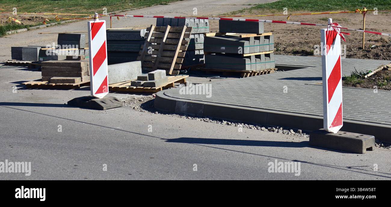 A lot of concrete blocks ant tiles in the street reconstruction site ...