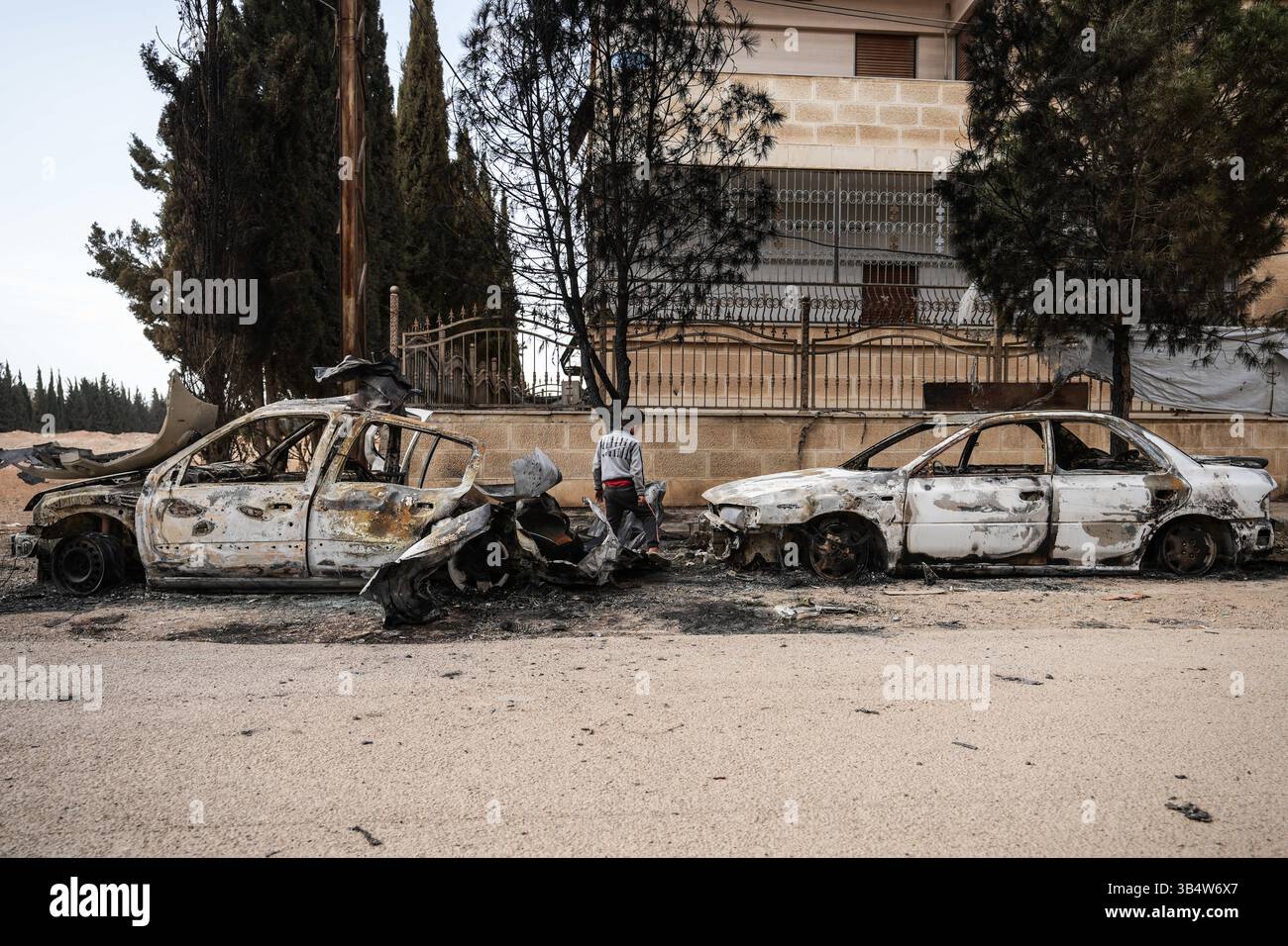Ashrafiyat Sahnaya, Syria. 01st May, 2025. Burnt-out cars are seen in ...