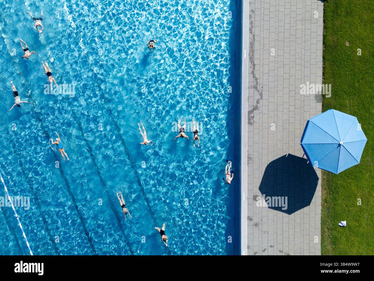 Munich, Germany. 01st May, 2025. Bathers enjoy the beautiful weather in ...
