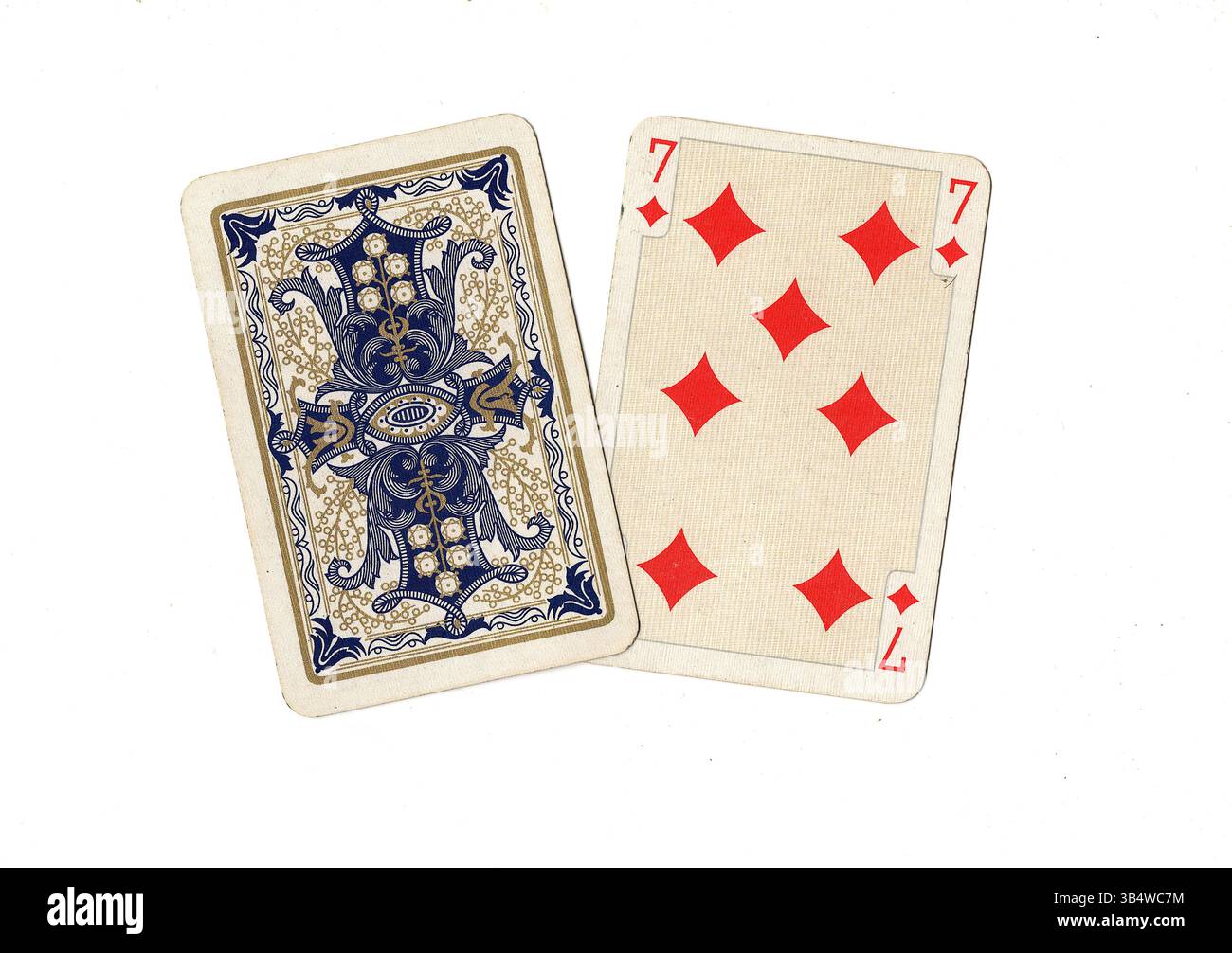 A pair of antique playing cards with one card revealed isolated on a ...