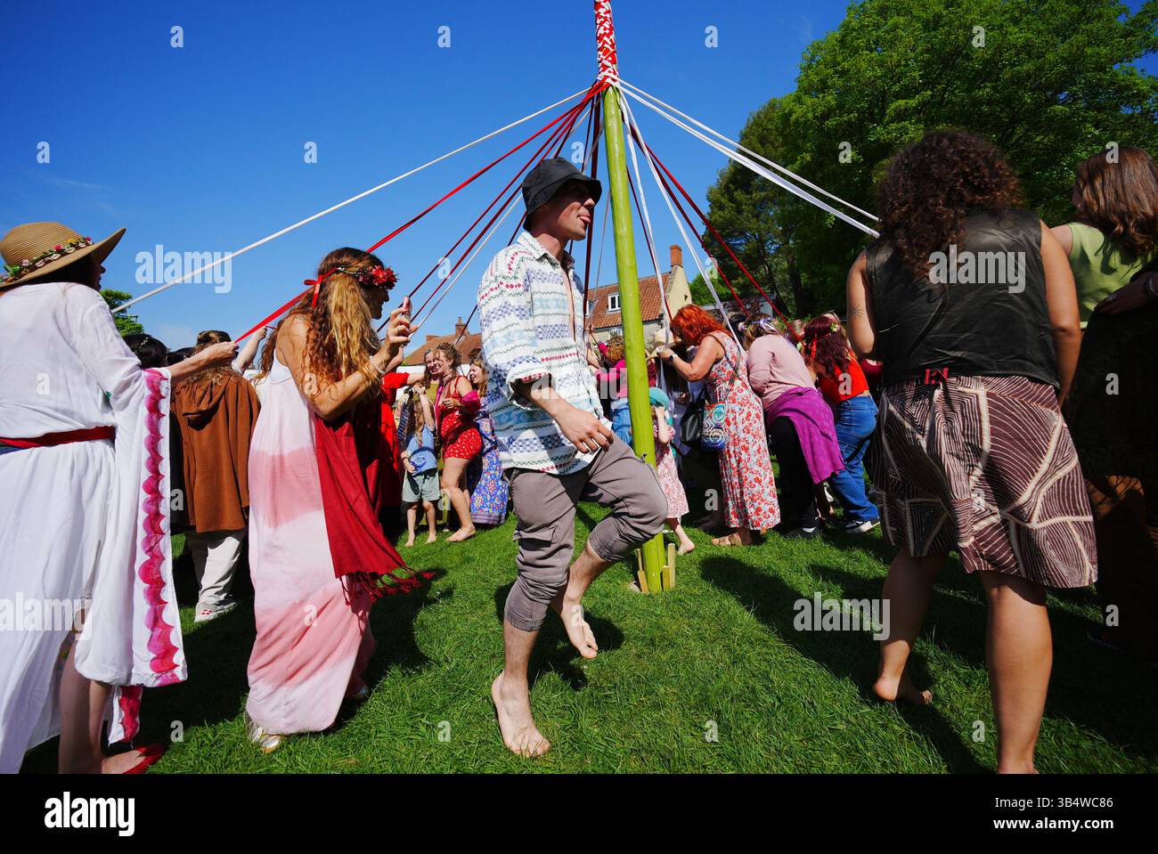 People during the Beltane celebrations at Glastonbury Chalice Well ...