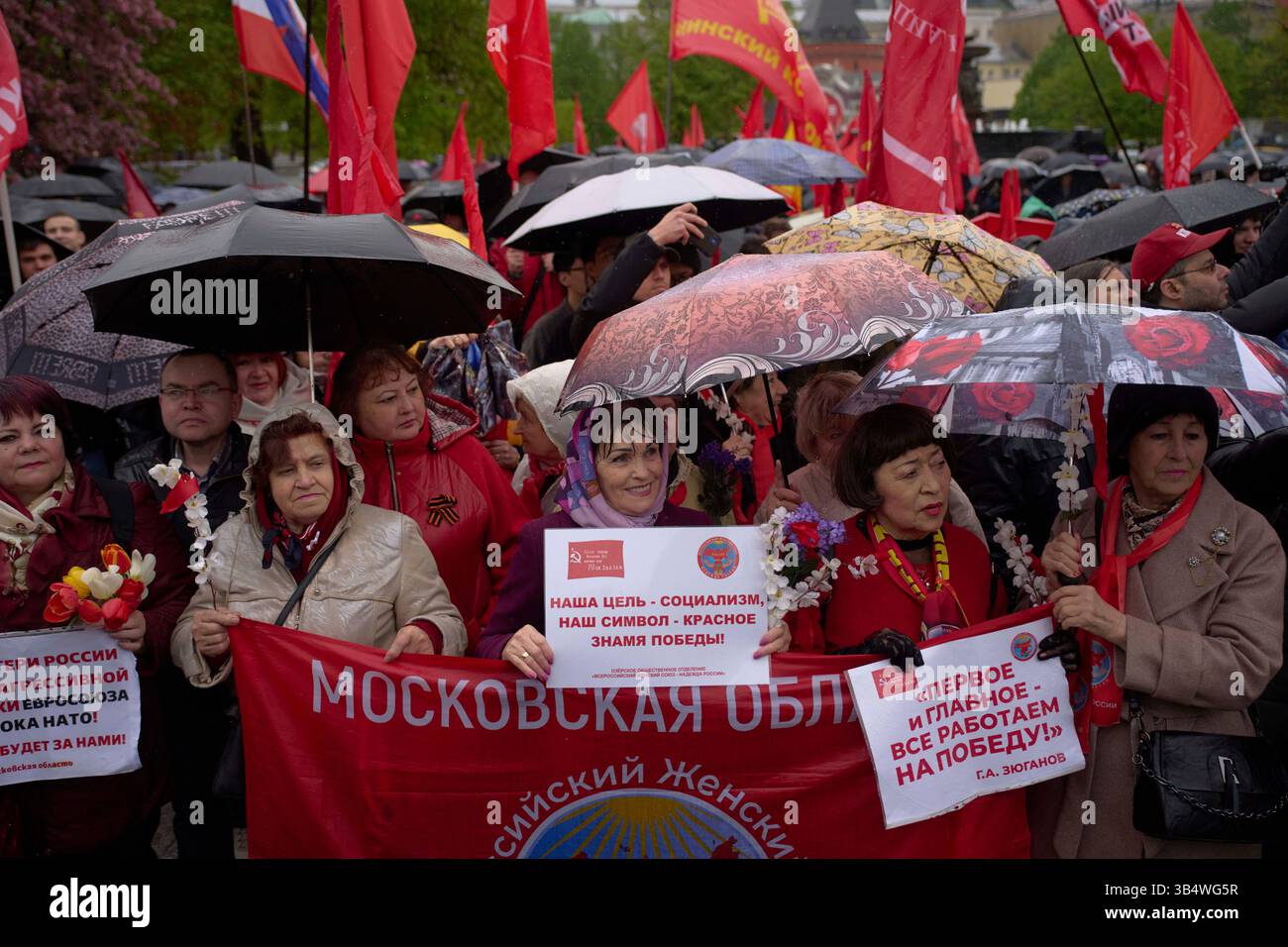 Russian Communist Party's supporters with poster reading "Our goal is ...