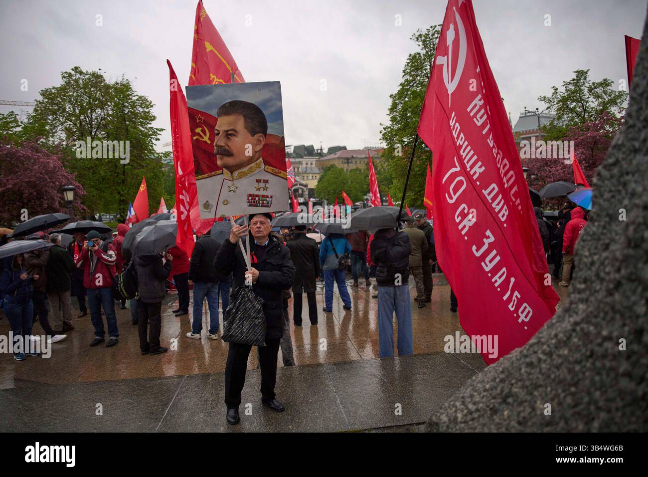 Russian Communist Party's supporters with a portrait of former Soviet ...